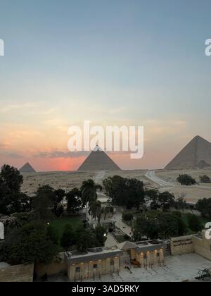 Sunset over the Great Pyramids of Giza, Egypt Stock Photo - Alamy