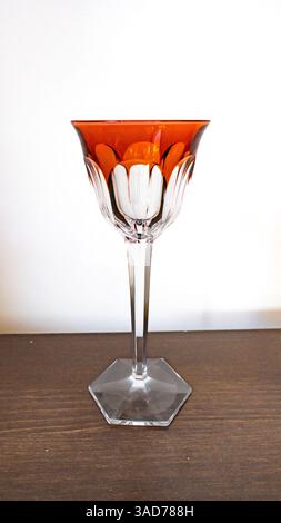 Empty glass on orange background Stock Photo - Alamy