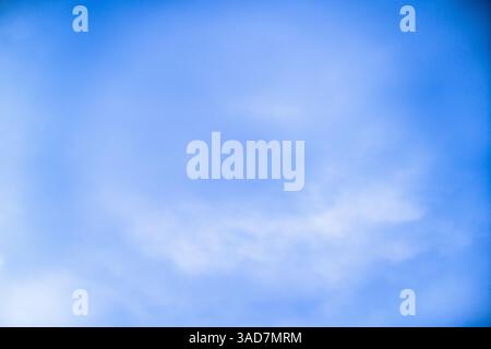 Bright cloud formations drifting in clear sky forming calming ...