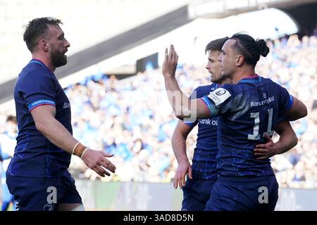 Leinster's James Lowe (right) celebrates after score a try during the ...