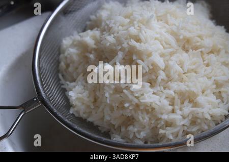 white rice boiled in colander Stock Photo - Alamy