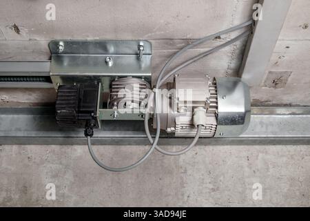 Parking gate sliding mechanism in garage of building. Close up of ...