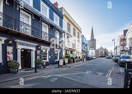 Tenby House in April 2025, and view of the spire of St Marys church ...