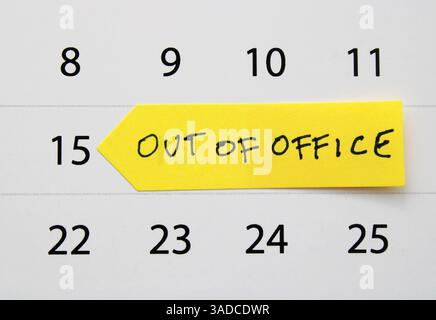 Out of the office, sticky note marking day on the calendar Stock Photo ...