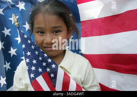 A child holds a harvest of vegetables in his hands. Selective focus ...