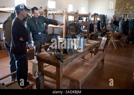 A Waffen-SS reenactor gives explanations about gear and equipment to ...