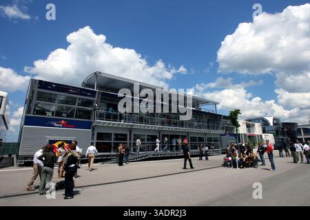 Fluffy clouds above the Red Bull Energy Station in the paddock ...