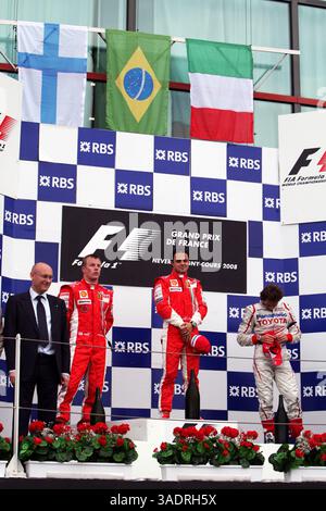 The podium (L to R): Kimi Raikkonen (FIN) Ferrari, second; Sebastian ...