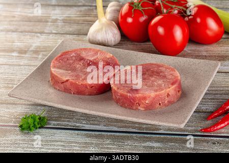 Raw round tuna fish uncucked fillet Stock Photo - Alamy