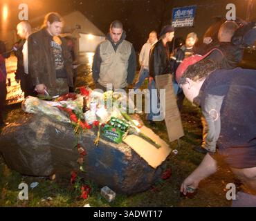 Dec 09, 2004; Columbus, Ohio, USA; Flowers left by a fan sit on a rock ...