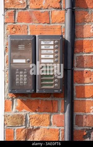 Intercom on a red brick wall Stock Photo - Alamy