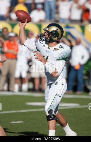 Colorado State quarterback, Pete Thomas, listens to a coach during a ...