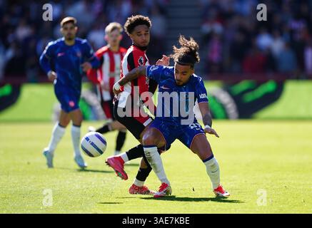Brentford's Kevin Schade (left) and Chelsea's Cole Palmer battle for ...