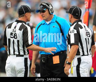 head linesman Jim Mello (48) looks up during an NFL football game ...