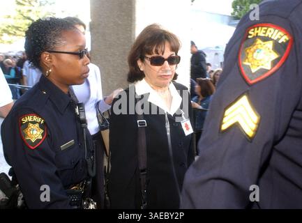Nov 12, 2004; Redwood City, CA, USA; Listening to a radio on her ...