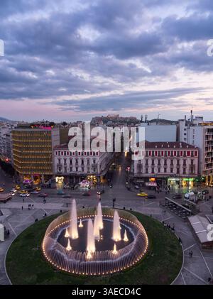 Downtown city intersection featuring historic stone building in ...