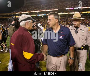 Arizona State Interim head coach Shaun Aguano warms up before an NCAA ...