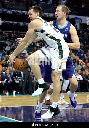 Milwaukee guard Pat Connaughton, left, drives against Oklahoma City ...