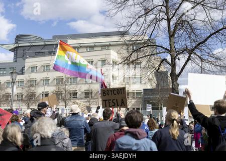 A protester holds a sign reading “The U.S. is a rogue state,” during a ...