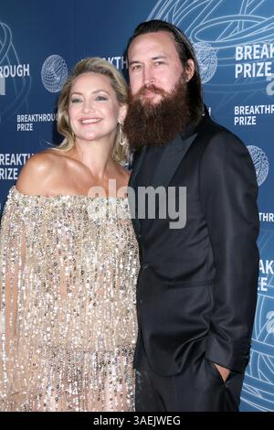 Danny Fujikawa, left, and Kate Hudson arrive at the 83rd Golden Globes ...