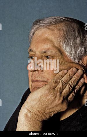 Caucasian man's portrait isolated over green studio background with ...