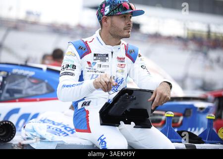 Kyle Larson walks to his car before a NASCAR Cup Series auto race at ...