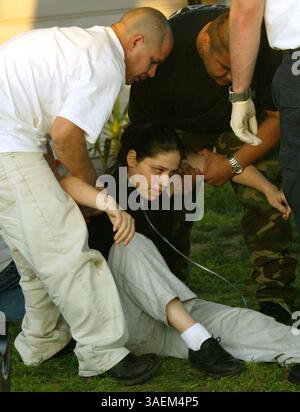 Mar 12, 2004; Fresno, CA, USA; A police officer with a shotgun secures ...