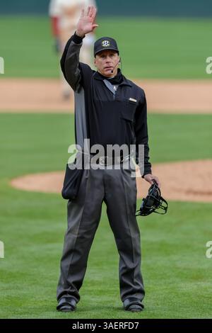 April 8, 2025: Home plate umpire Ramon Hernandez meets with his fellow ...
