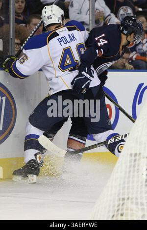 St. Louis Blues forward Jordan Kyrou, right, passes the puck in front ...