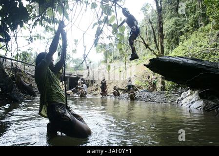 Jun 13, 2002; Sarawak, Malaysia; ALONG SEGA (R), a nomadic Penan chief ...