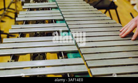 A young guy playing the vibraphone at a music school Stock Photo - Alamy