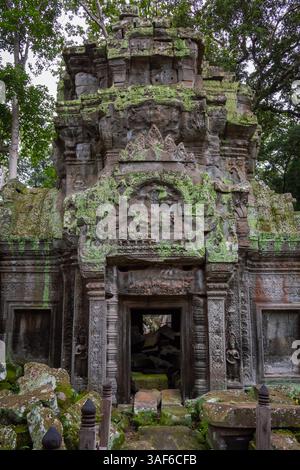 Green moss-covered stone building and bricks at Ta Prohm Tomb Raider ...