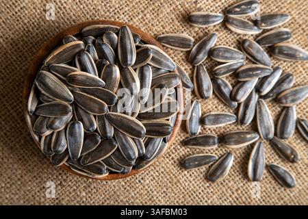 Bowl of black sunflower seeds, closeup Stock Photo - Alamy