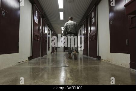 An Army guard walks the hallway in Camp 5 at U.S. Navy base Guantanamo ...