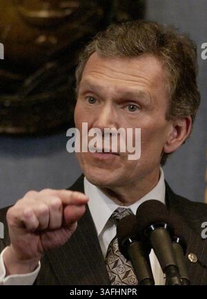 Senate Minority Leader Tom Daschle of S.D., left, looks on as Sen ...