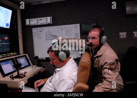 Detection ENF Officer Joseph Pavero (right) and Predator pilot Tim Just ...