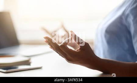 Businesswoman meditating in office, closeup with space for text. Zen ...