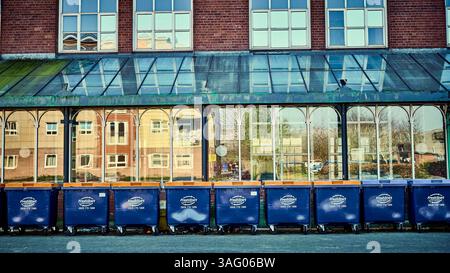 Empty rubbish skips lined up outside Trencherfield Mill in Wigan Stock ...