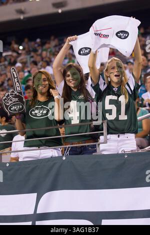 New York Jets fans cheer during the second half of an NFL football game ...