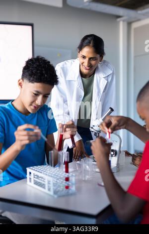 In school, students conducting science experiments with test tubes and ...