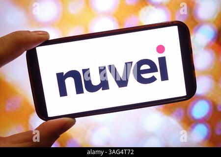 In this photo illustration, the Nuvei company logo is seen displayed on ...