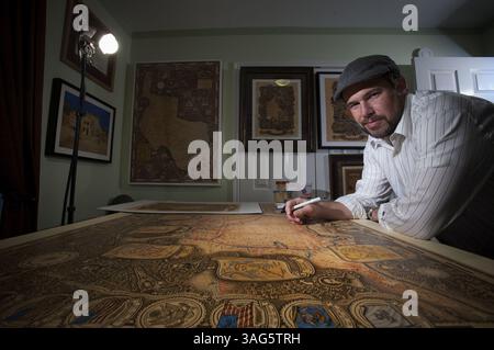 Map artist Christopher Smith poses for portrait in his Leander, Texas ...