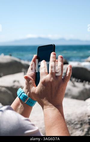 Close-up of a hand taking photos Stock Photo - Alamy