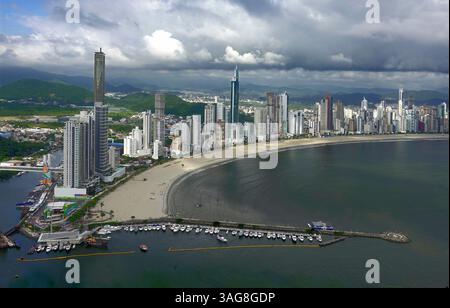 Aerial view of seaside Balneario Camboriu cityscape, illuminated ...