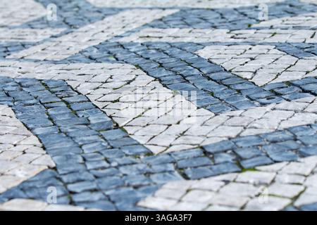 Detail of a typical portuguese cobblestone hand made pavement - Lisbon ...