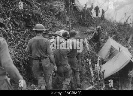 Stretcher bearers convey the wounded to the regimental aid post from a ...