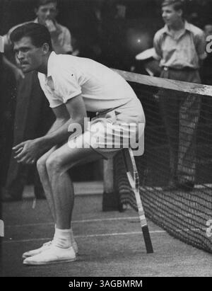 American Budge Patty rests on his racquet during the record doubles set ...