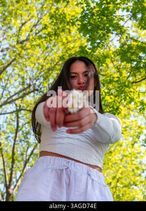 Beautiful Gen Z woman taking a break in a parking garage in the city of ...