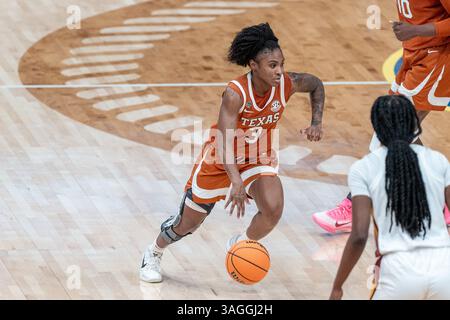 Texas guard Rori Harmon drives against James Madison guard Zakiya ...