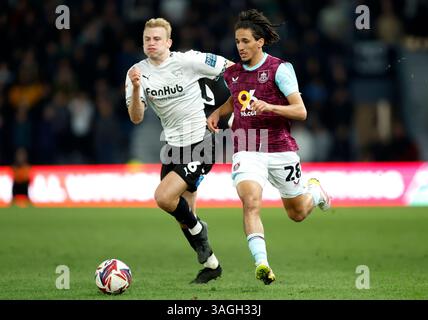 Derby County's Sondre Langas (left) scores their side's second goal of ...